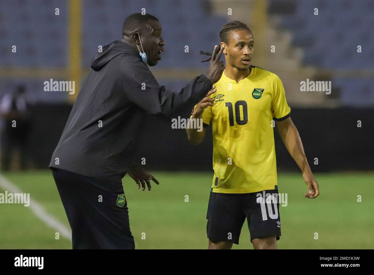 Jamaica's coach Theodore Whitmore, left, gives instructions to Bobby ...