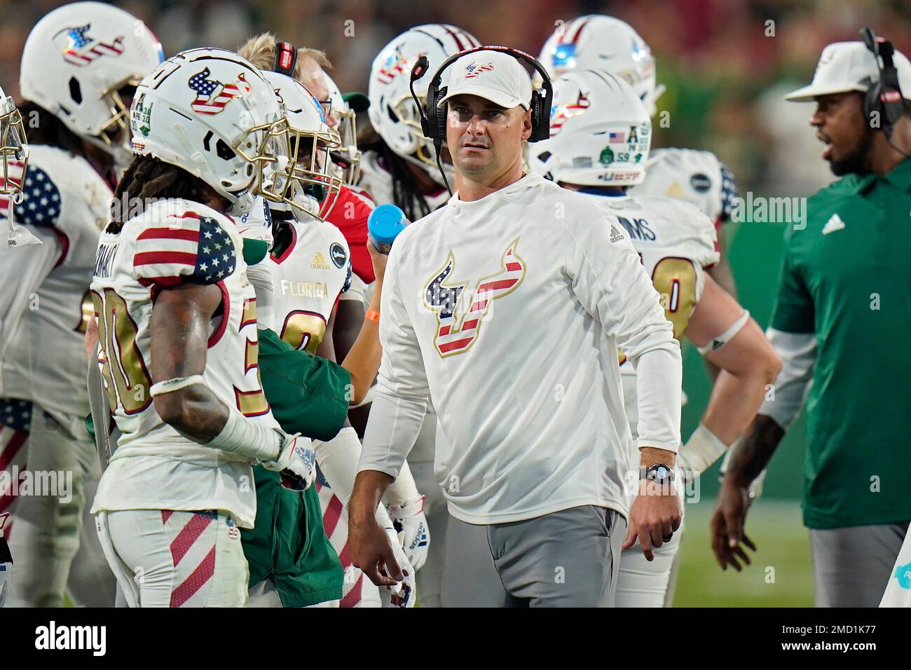 South Florida head coach Jeff Scott talks to his team during the second ...