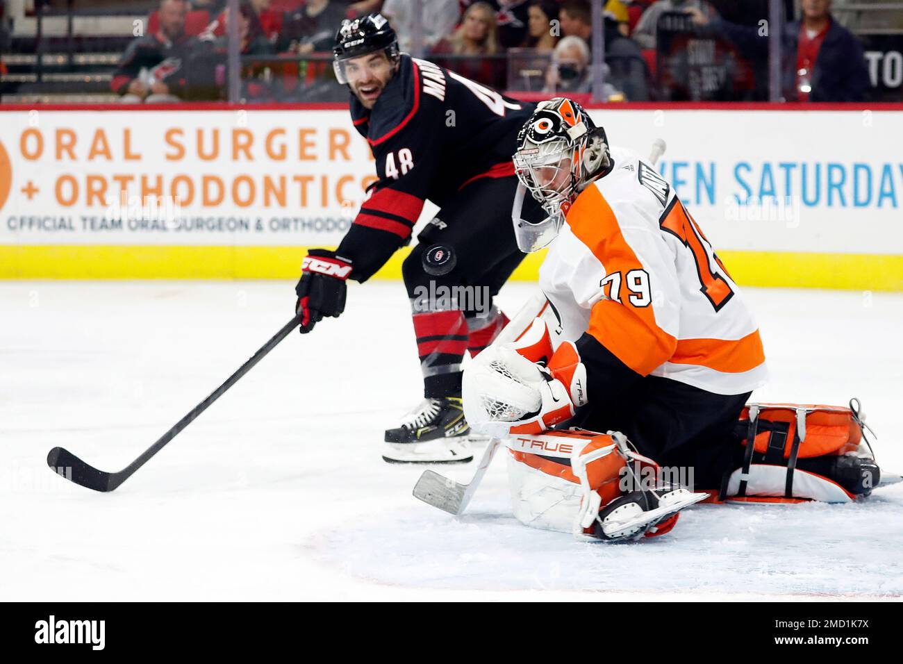 Carolina Hurricanes' Jordan Martinook (48) watches as his shot deflects ...