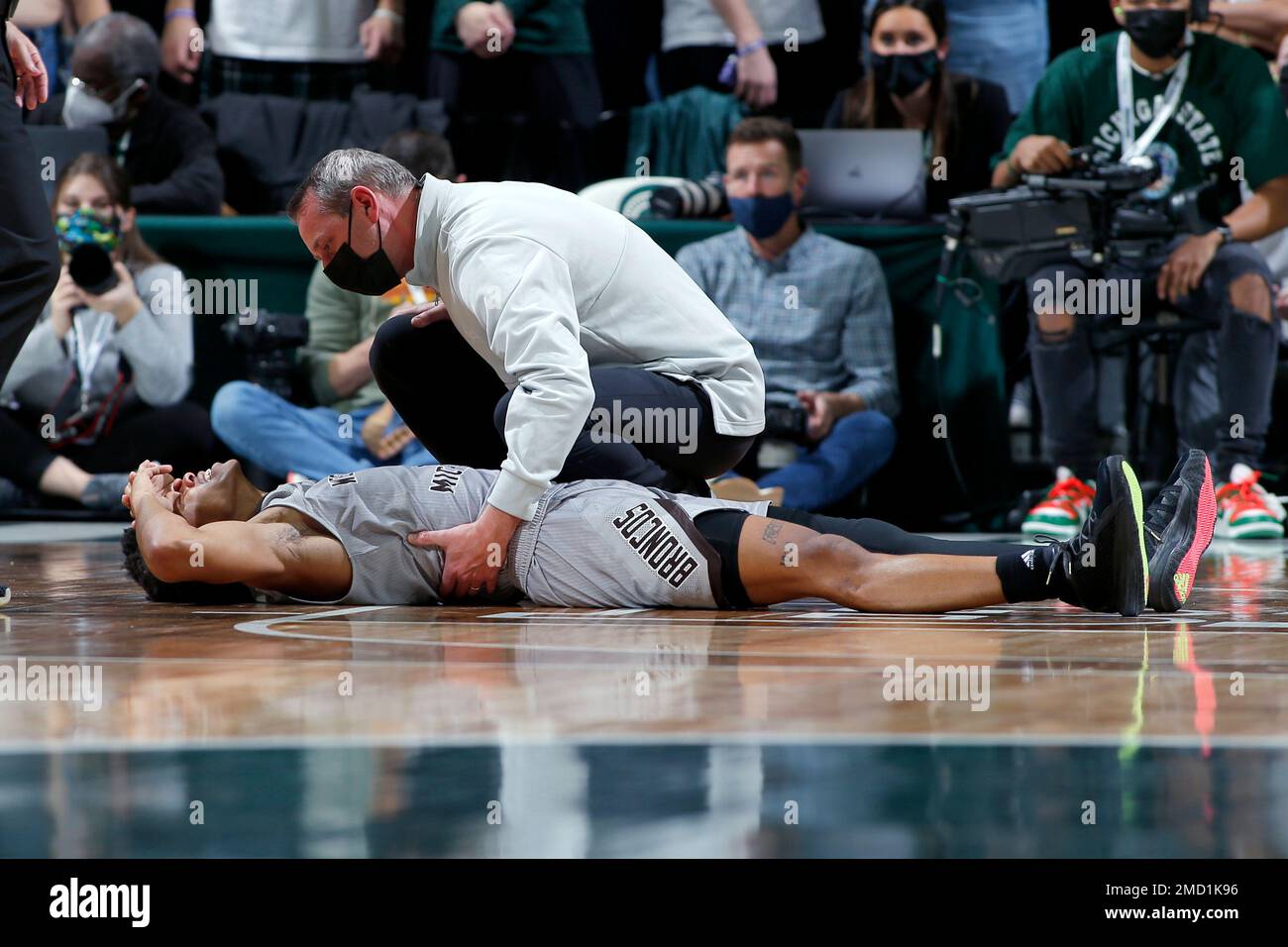 Western Michigan's B. Artis White is tended to after an injury in the ...