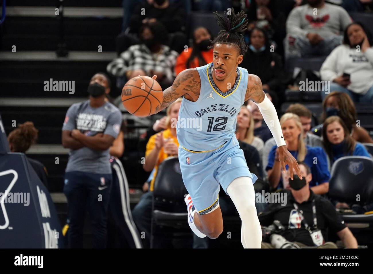 Memphis Grizzlies' Ja Morant (12) brings the ball up court in the first ...