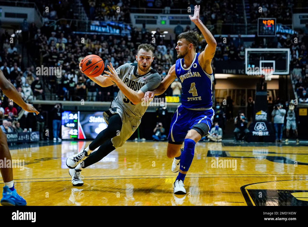 Purdue guard Sasha Stefanovic (55) drives on Indiana State guard Cooper ...