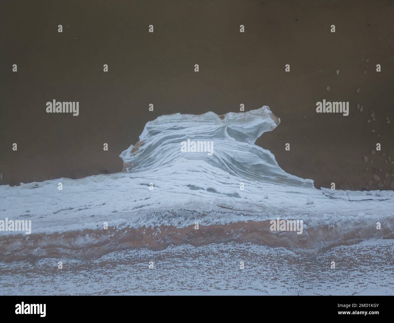 Aerial top down view of ice piece frozen to sea shore Stock Photo - Alamy