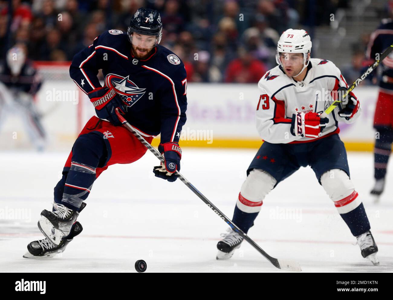 Columbus Blue Jackets forward Sean Kuraly, left, chases the puck in ...