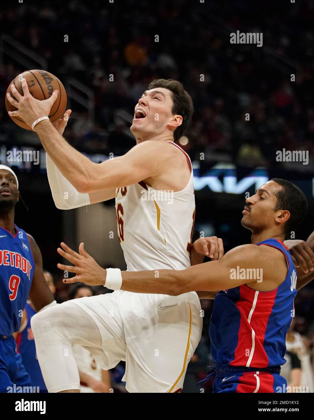 Cleveland Cavaliers' Cedi Osman, left, drives to the basket against ...