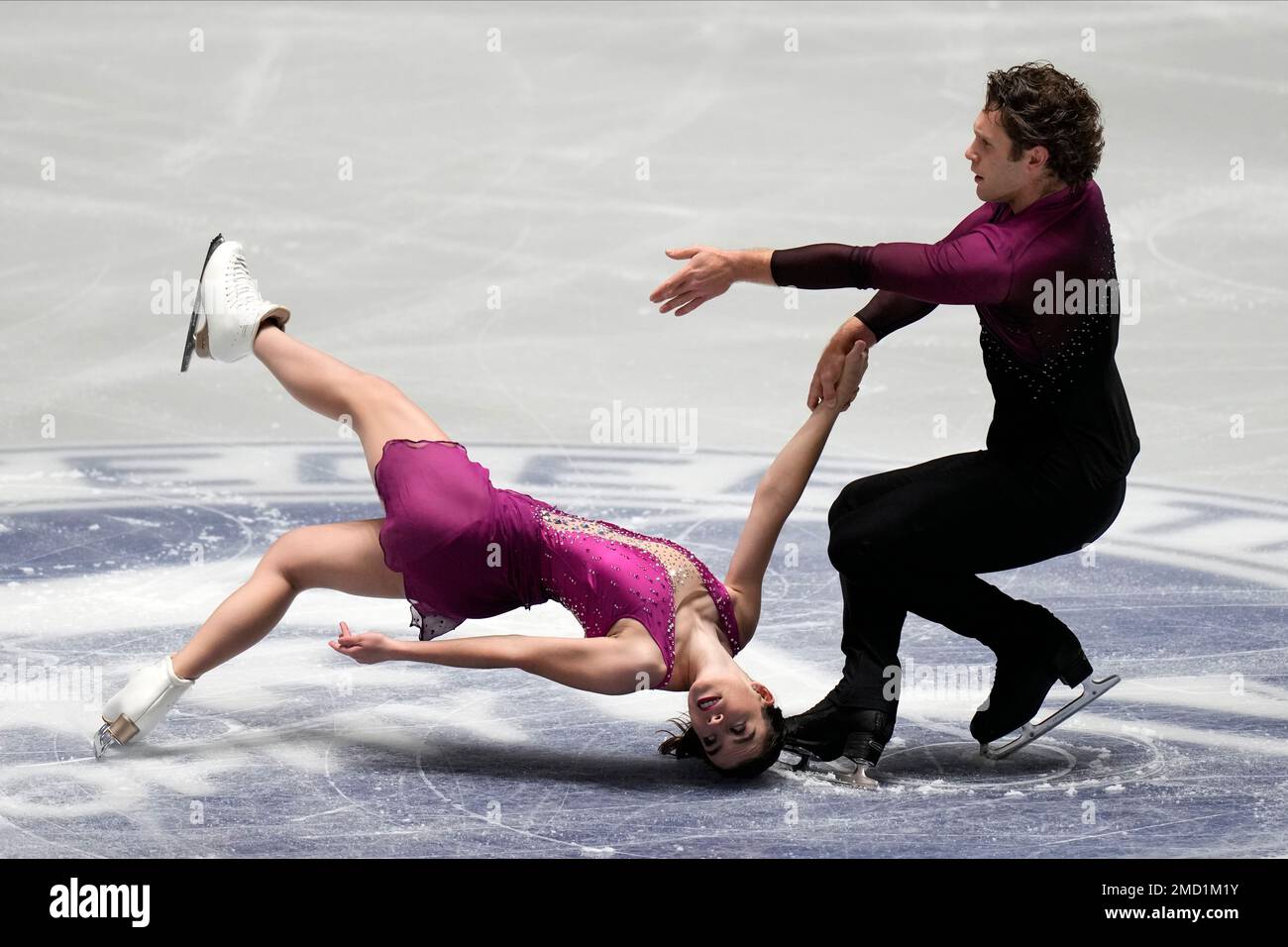 Evelyn Walsh and Trennt Michaud, of Canada, perform during the pairs ...