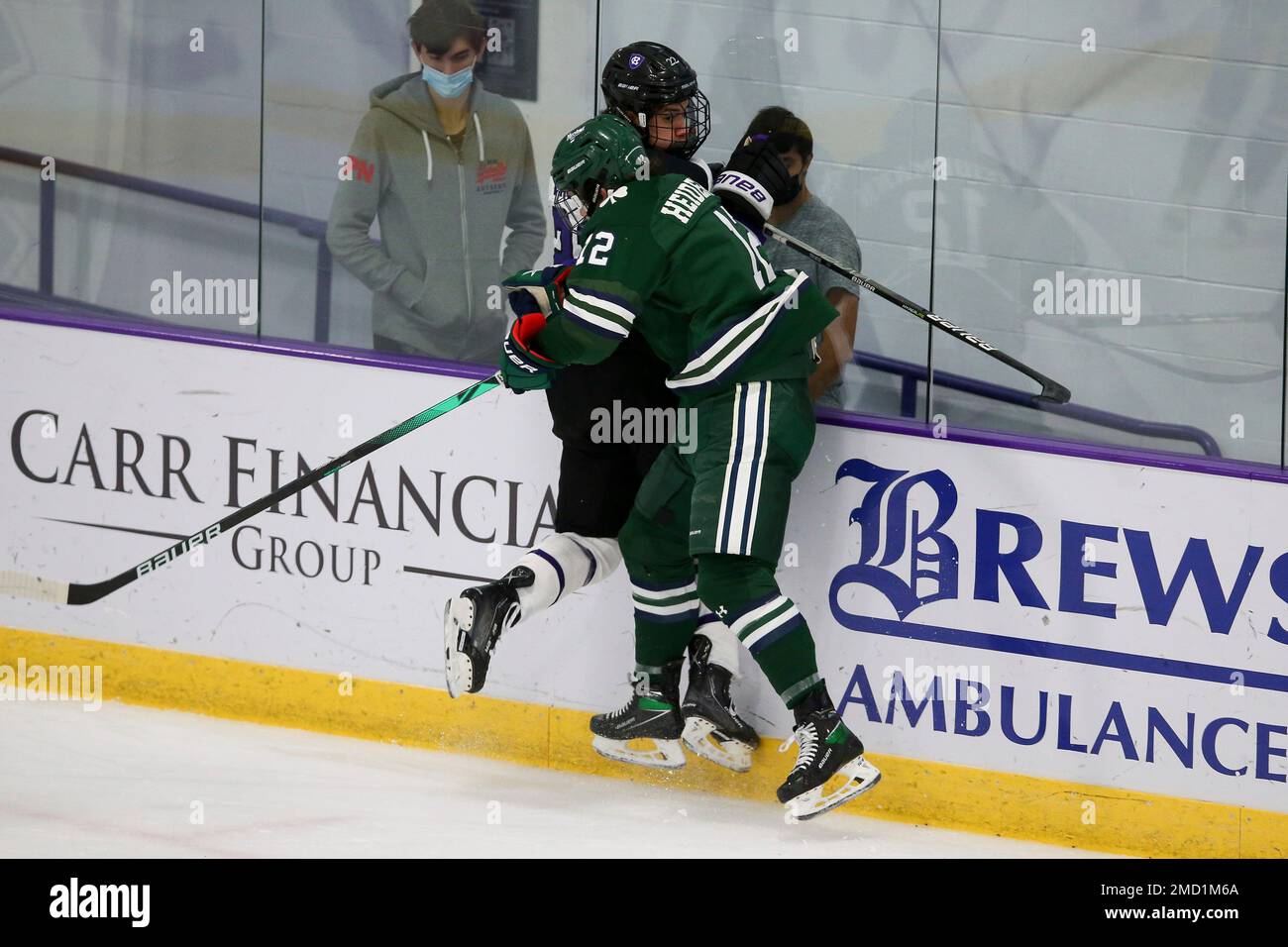 Mercyhurst's Austin Heidemann (12) checks Holy Cross's Lucas Thorne (22 ...