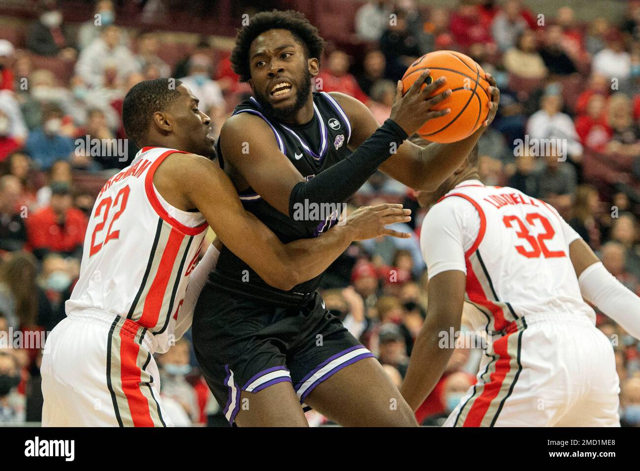 Niagara's Noah Thomasson, center drives into Ohio State's Malaki ...
