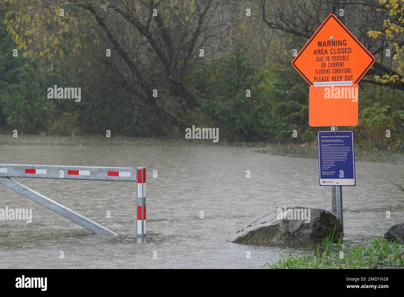 A sign warning of flooding conditions near an entrance to Tolt ...