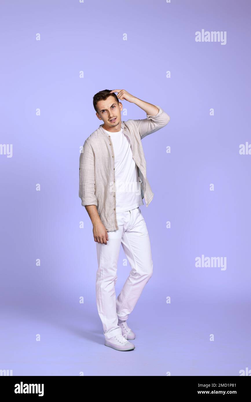 positive dreamy thoughtful young handsome man thinking Stock Photo - Alamy