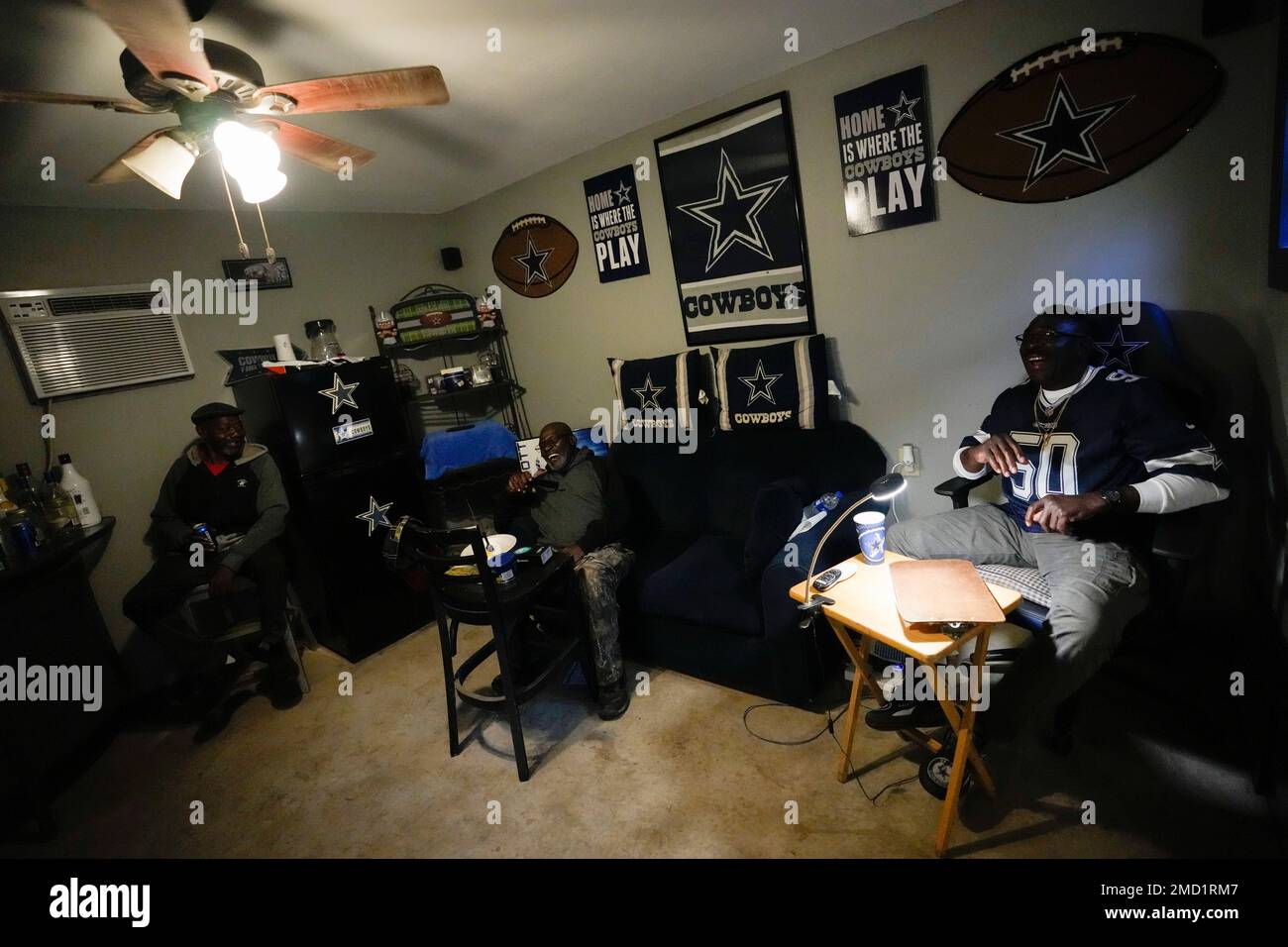 Ricky Wright, center, jokes with friends Robert Smalls, right, and ...