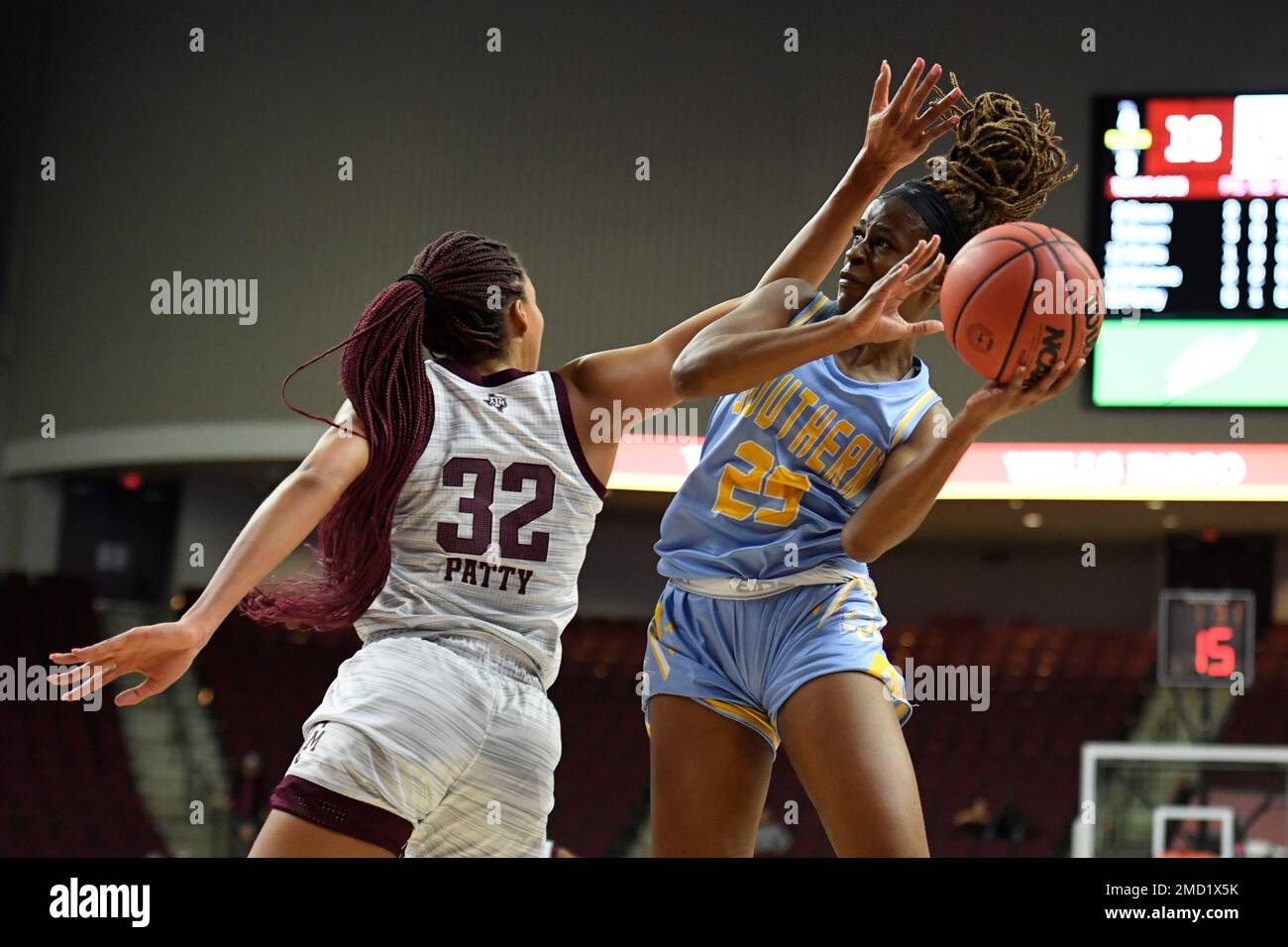 Southern University guard Genovea Johnson (25) is defended by Texas A&M ...