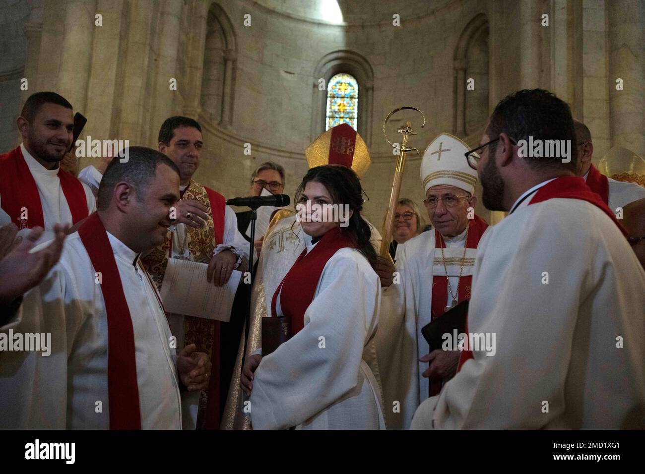Sally Ibrahim Azar, center, a Palestinian Christian and Council member ...