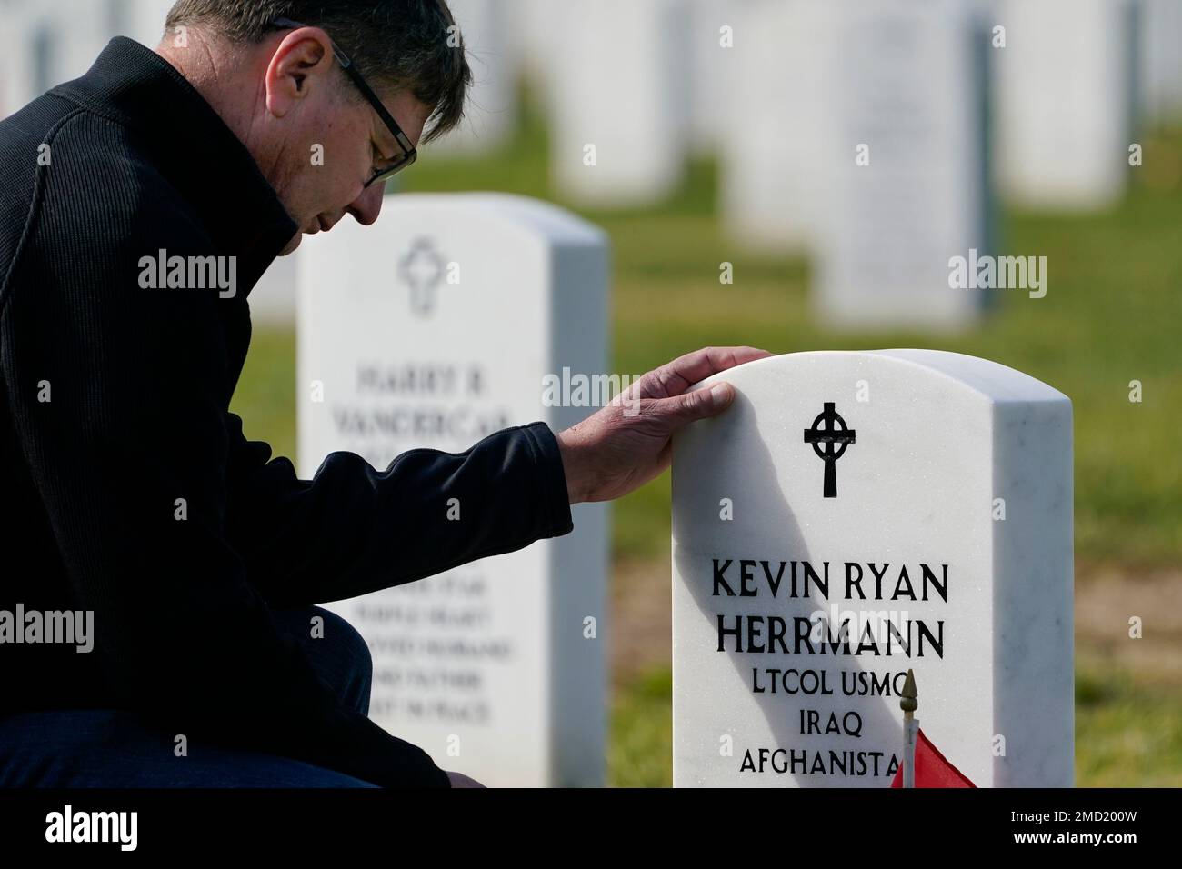 Retired U.S. Marine Corps Col. Kevin Herrmann rests his hand on the ...