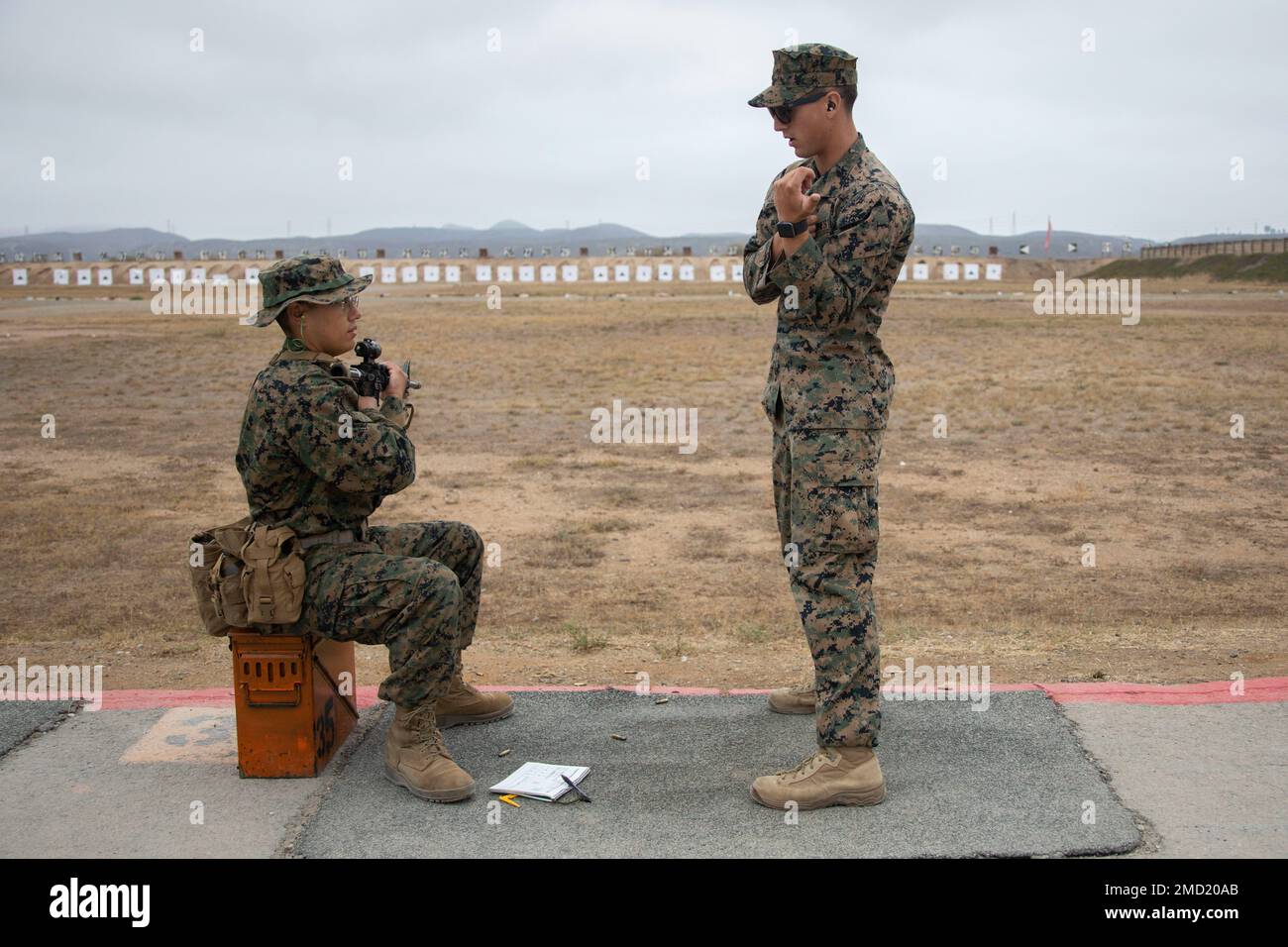 U.S. Marine Corps Lance Cpl. Nick J. Hartzler, a range coach with ...