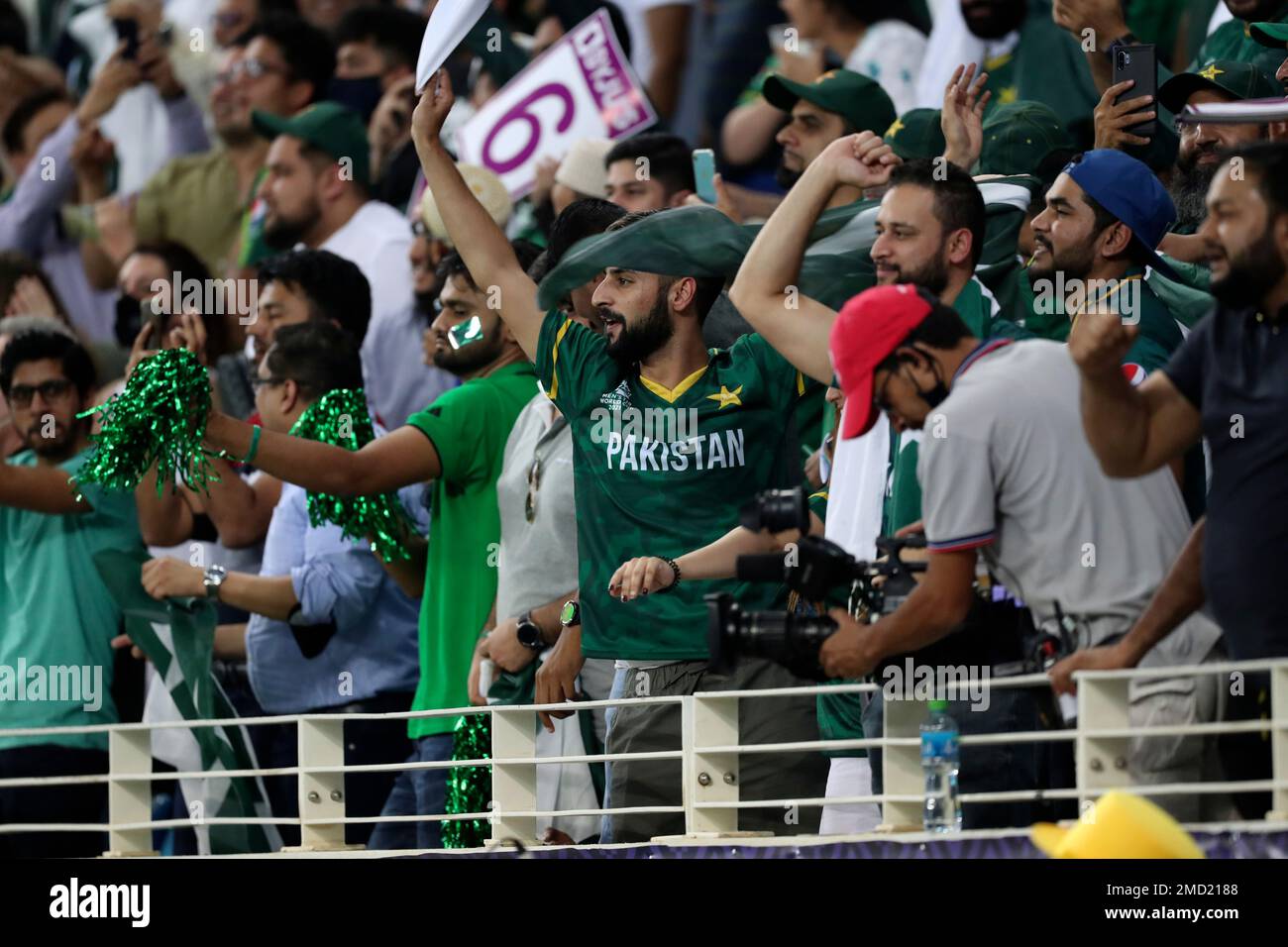 Pakistani cricket fans cheer for their team during the Cricket Twenty20 ...