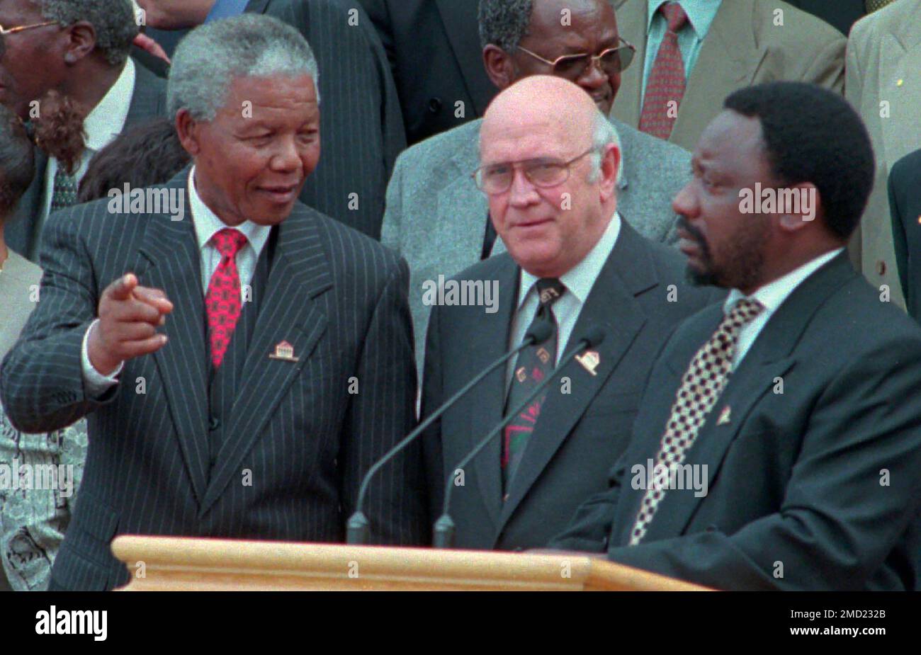 FILE - South African President Nelson Mandela, left, gestures while talking to chairman of the ...