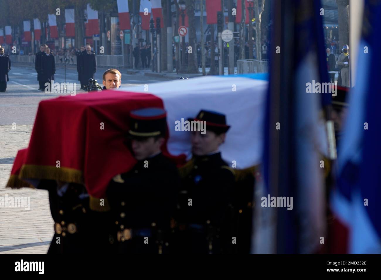 French President Emmanuel Macron watches French soldiers carrying the ...