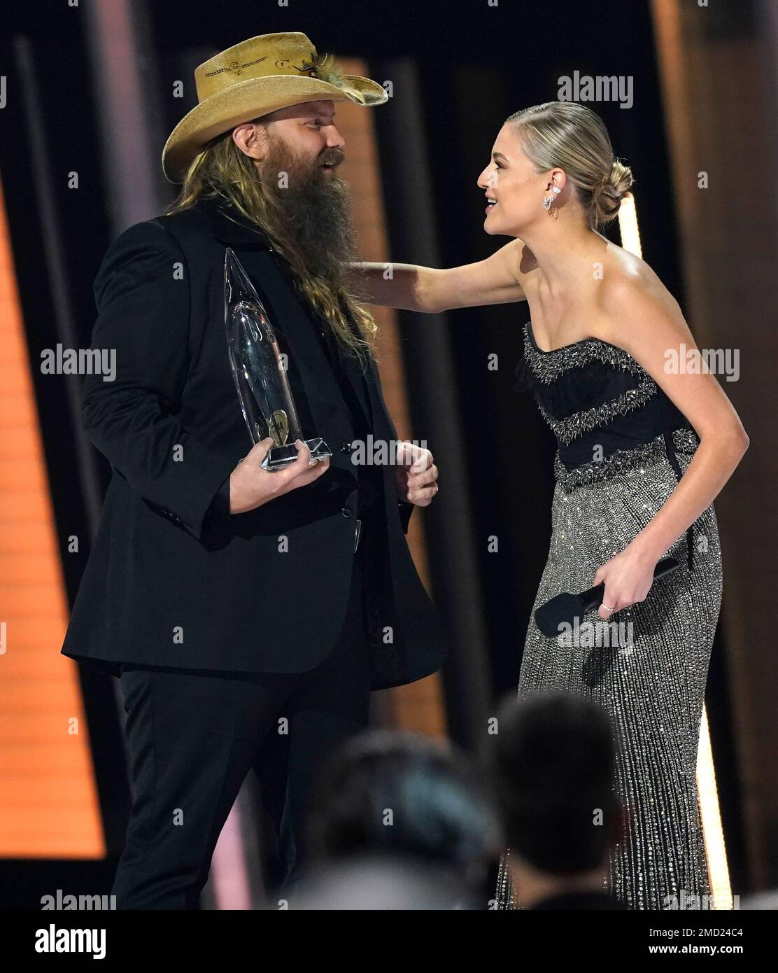 Kelsea Ballerini, right, presents Chris Stapleton with the award for ...