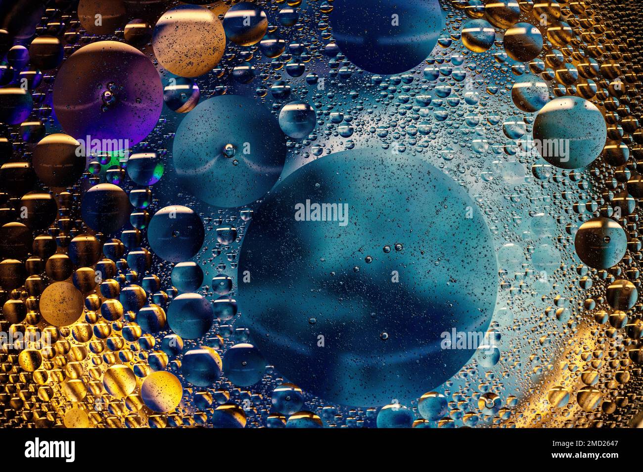 A close-up of oil bubbles in colorful water Stock Photo - Alamy