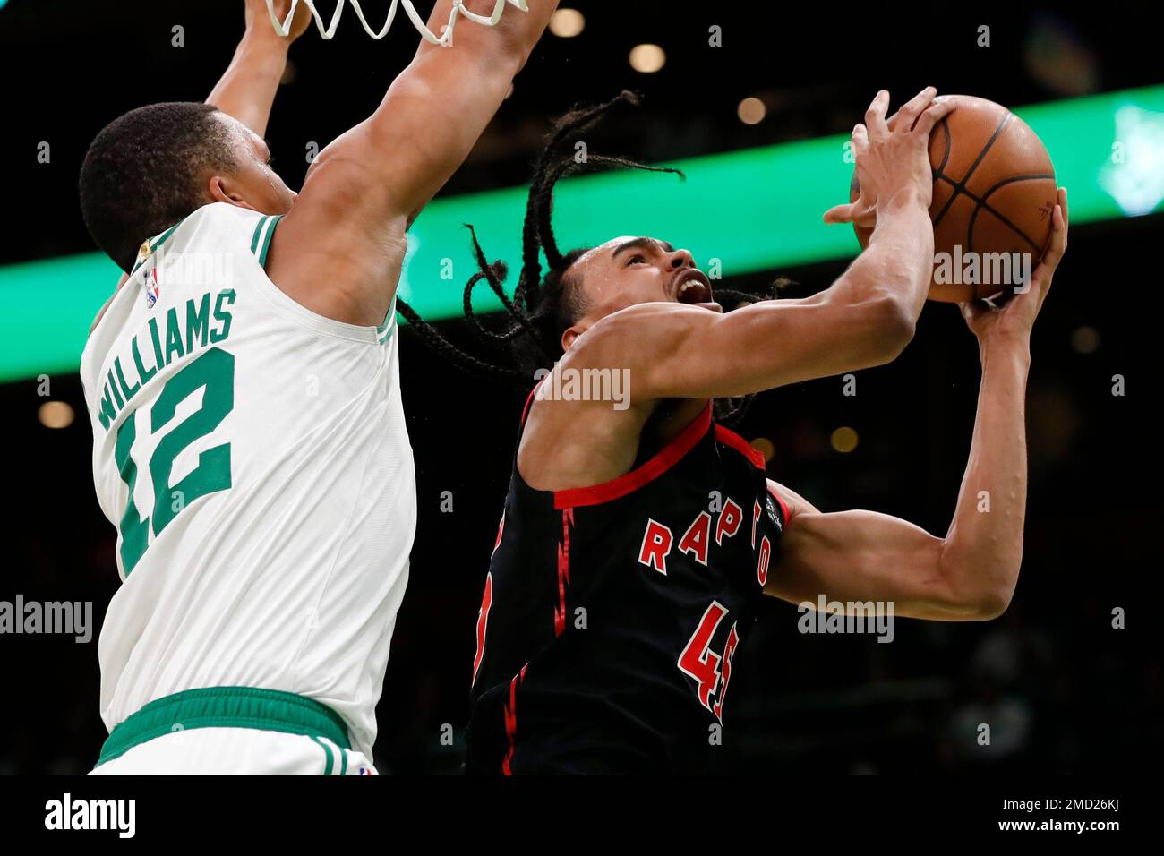 Toronto Raptors' Dalano Banton (45) shoots against Boston Celtics ...
