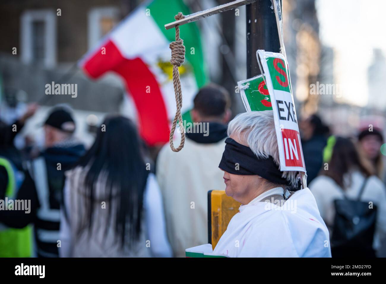 A protestor with a noose voices her opinion, "Stop Execution in Iran ...