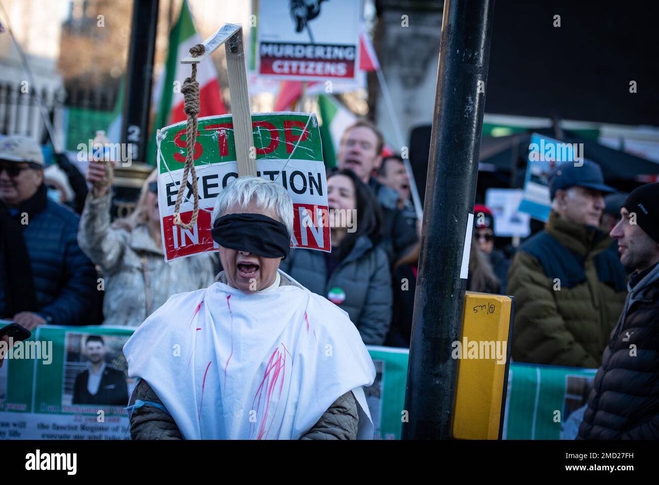A protestor with a noose voices her opinion, "Stop Execution in Iran ...