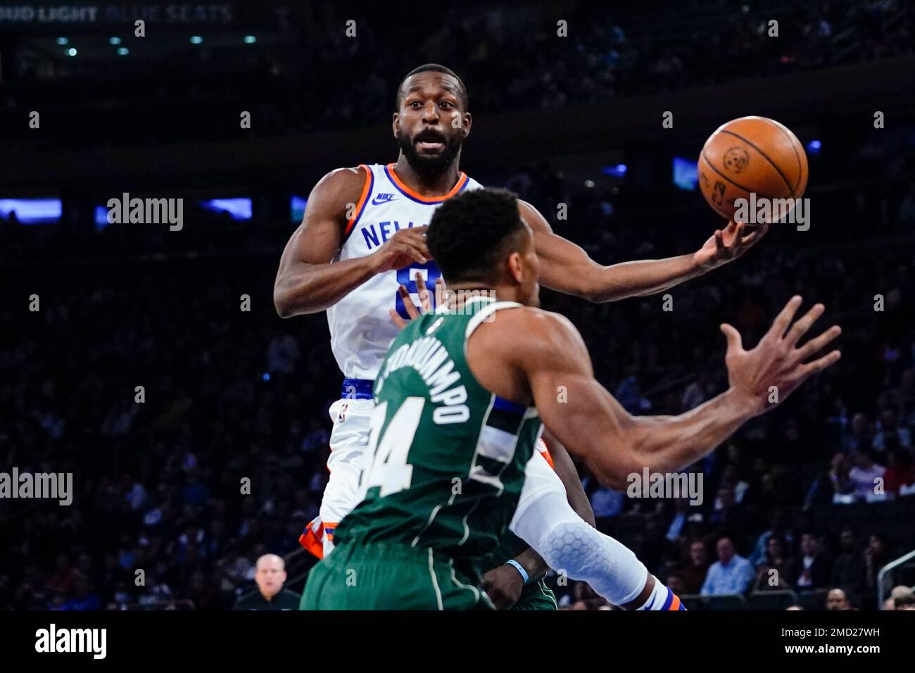 New York Knicks' Kemba Walker, above, passes away from Milwaukee Bucks' Giannis Antetokounmpo ...
