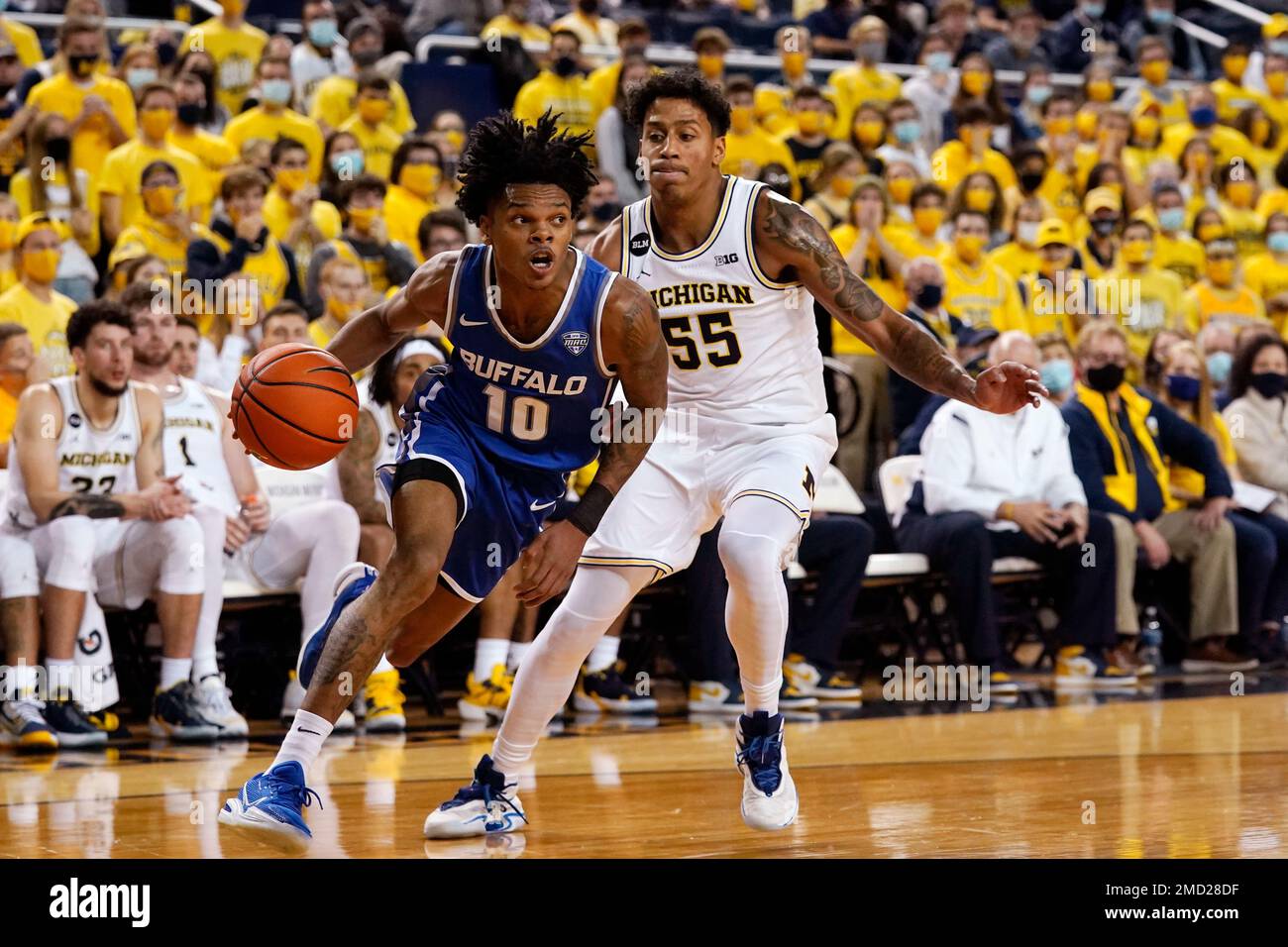 Buffalo guard Ronaldo Segu (10) drives as Michigan guard Eli Brooks (55 ...
