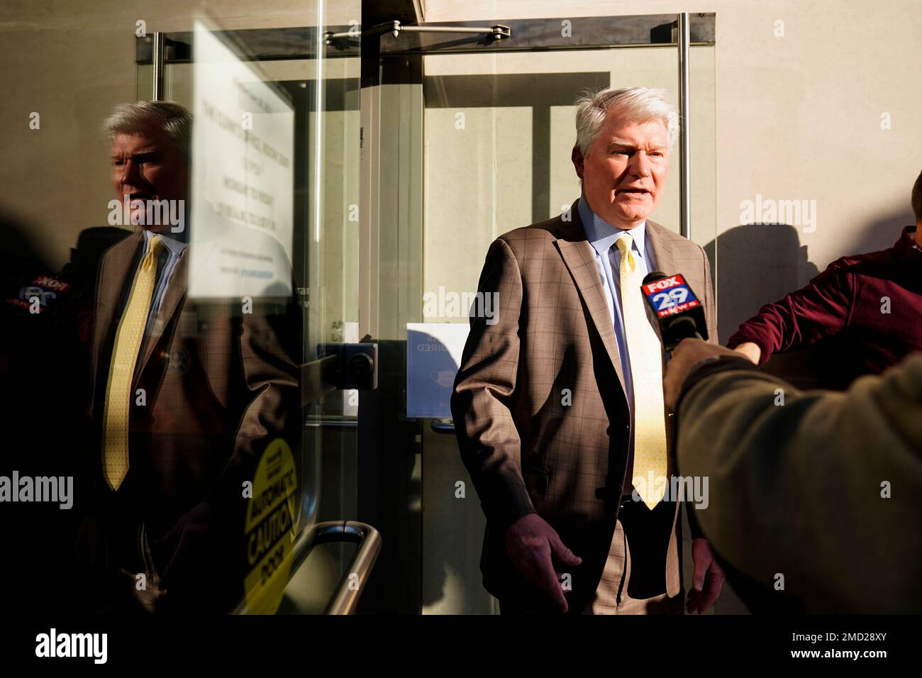 Johnny "Doc" Dougherty speaks with members of the media as he arrives ...