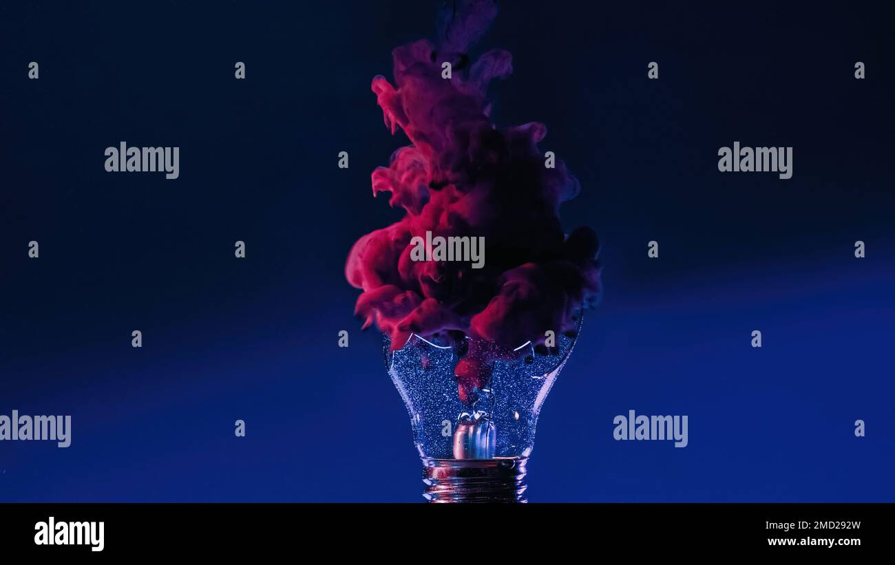 Color smoke in broken lamp ink water light bulb Stock Photo - Alamy