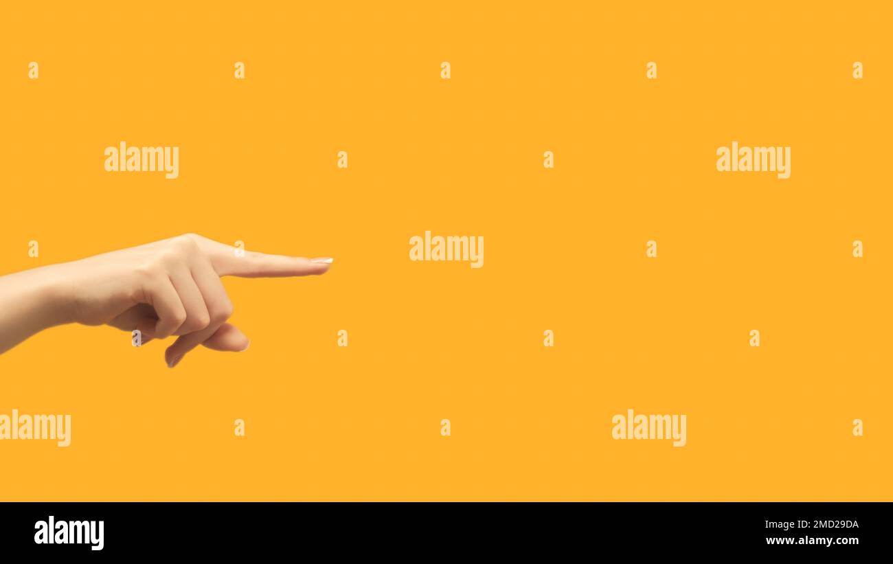 finger pointing advertising background hand orange Stock Photo - Alamy