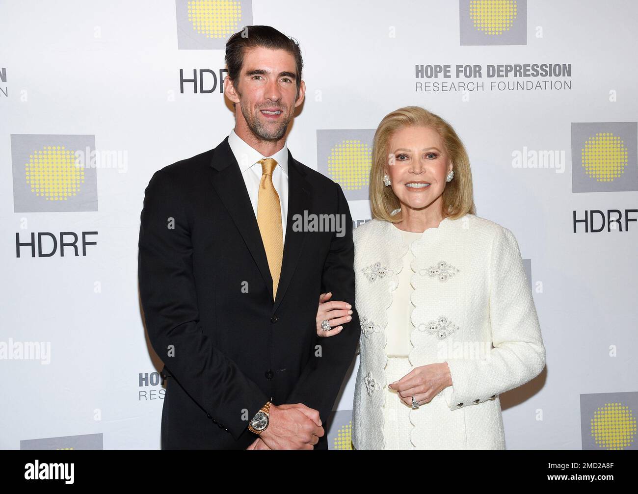 Former Olympic swimmer Michael Phelps, left, and HDRF founder ...