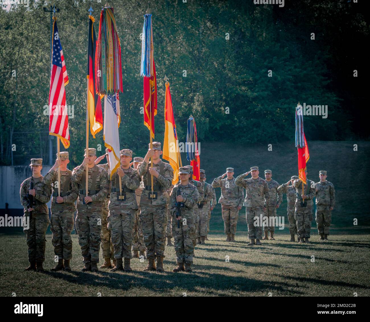 The color guard executing 'order arms' during a change of command ...