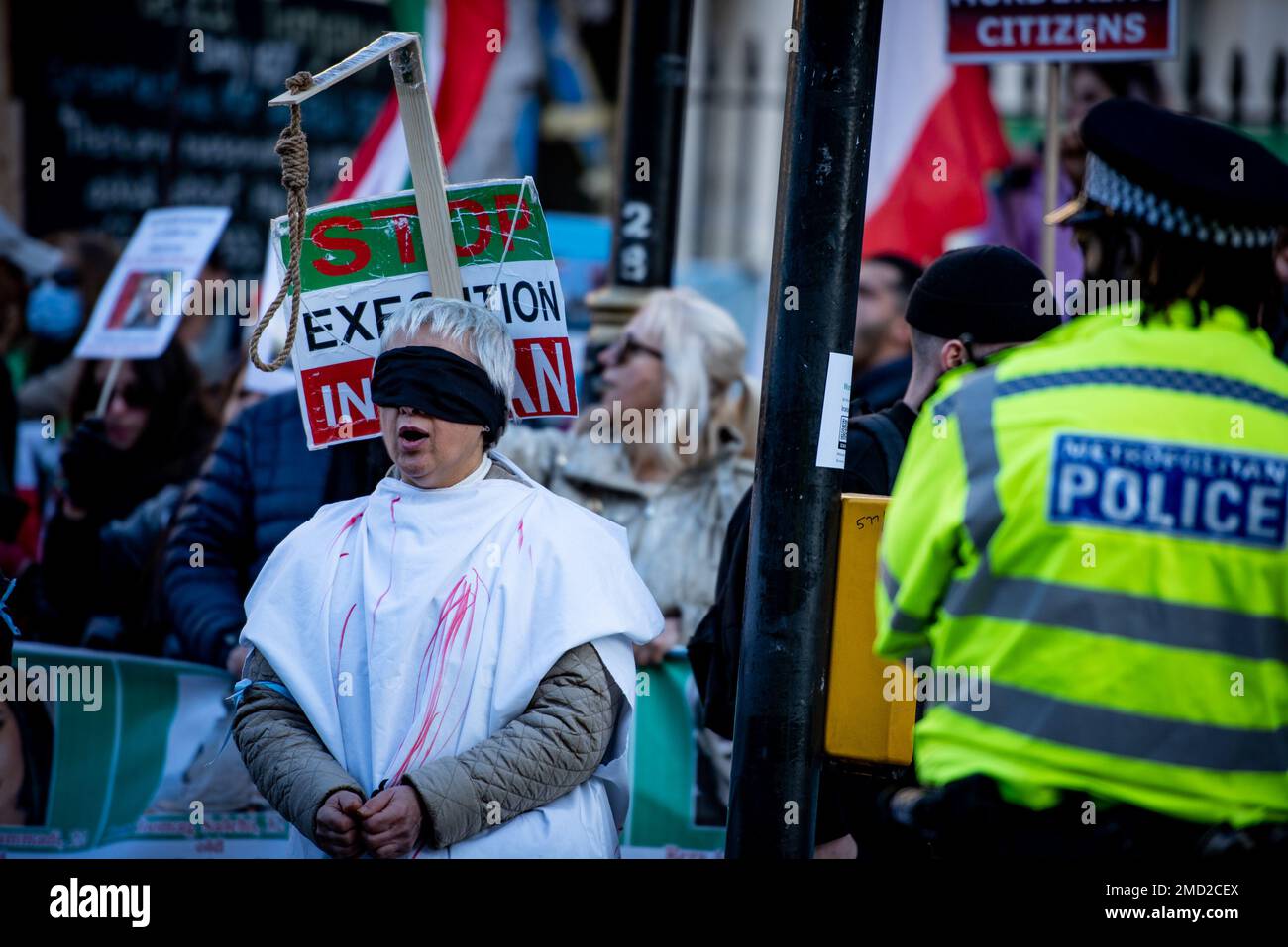 A protestor with a noose voices her opinion, "Stop Execution in Iran ...