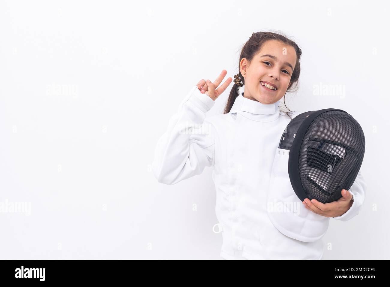 Little girl fencer with epee and mask Stock Photo - Alamy