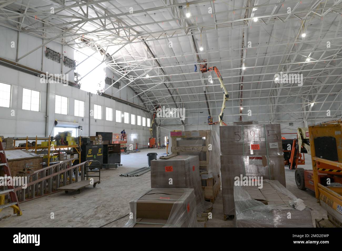 Contractors remodel an aircraft hangar July 12, 2022 at the 115th ...