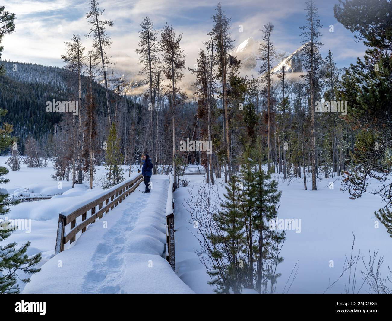 Winter Sawtooth mountains in Idaho with a snowshoer Stock Photo - Alamy