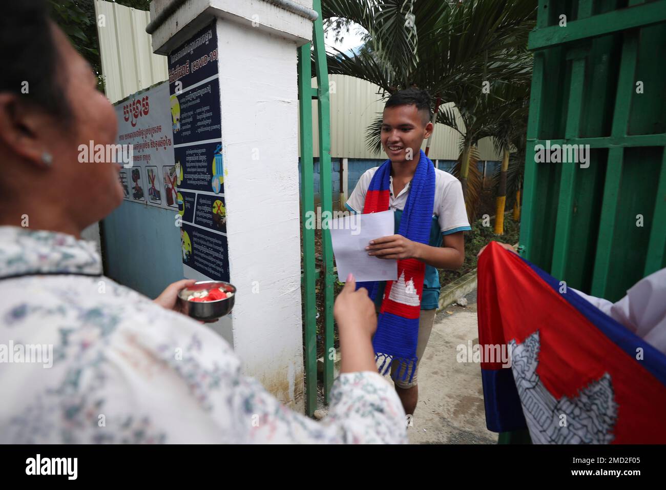 Kak Sovannchhay, center, walks out from the main prison of Prey Sar as ...