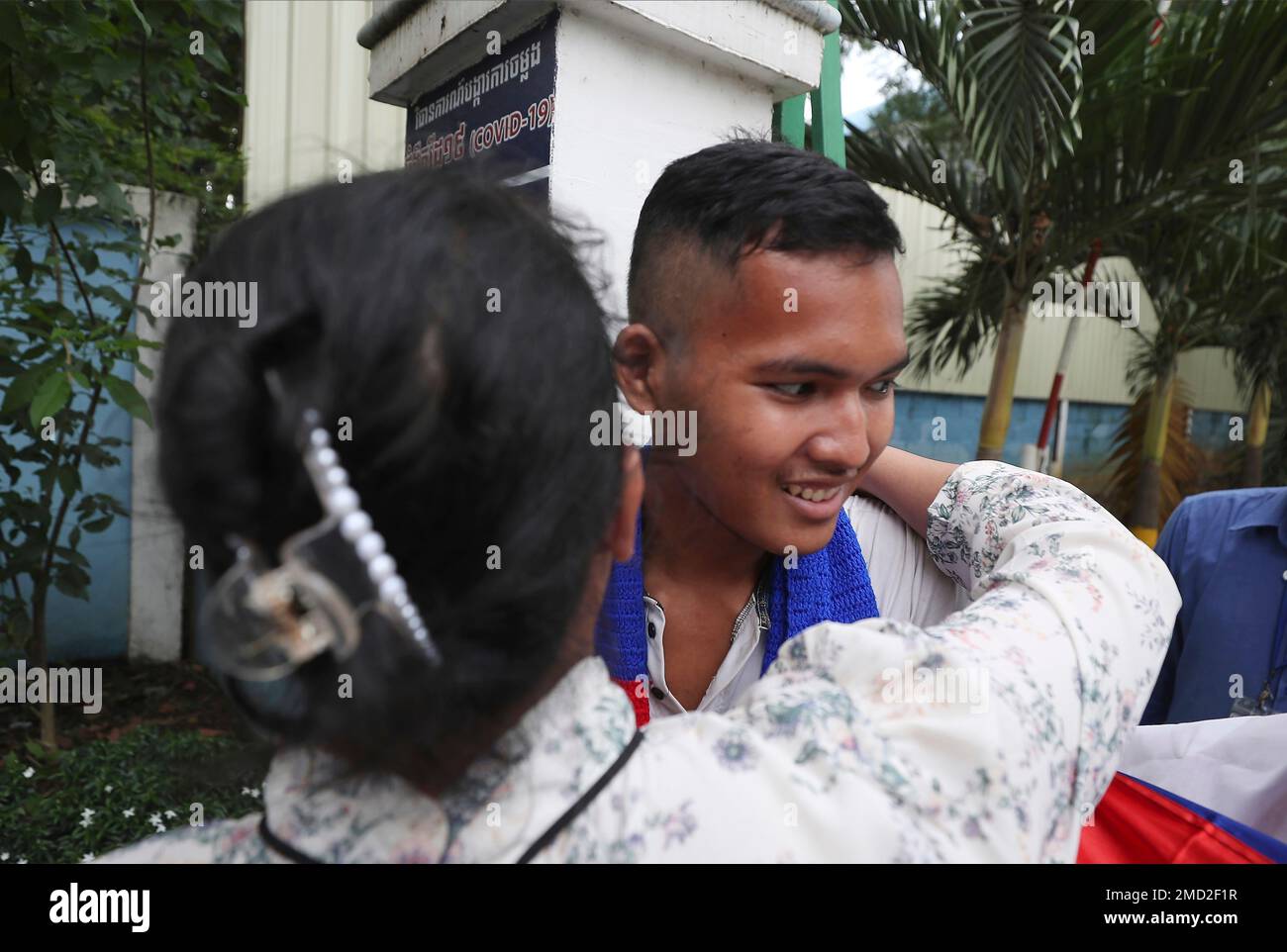 Kak Sovannchhay, 16, is hugged by his mother Prum Chantha outside the ...