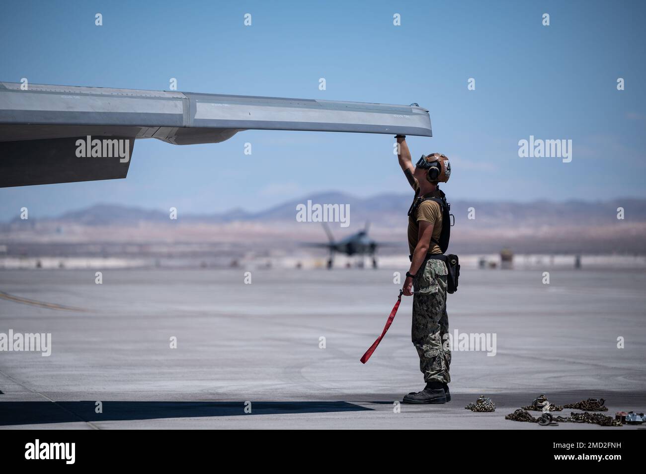 A U.S. Navy Sailor assigned to the Strike Fighter Squadron 147, Naval Air Station Lemoore ...