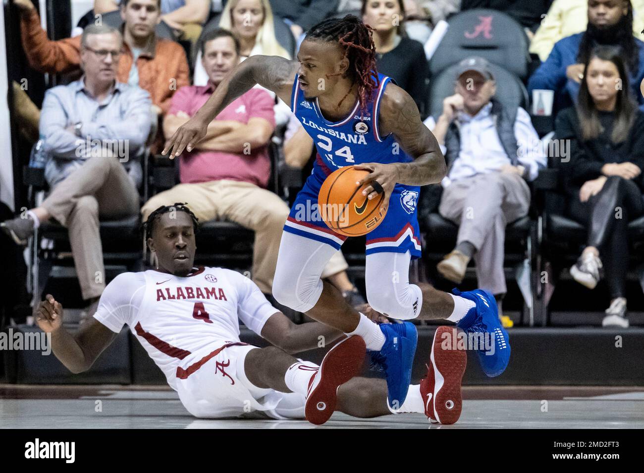 Louisiana Tech guard Cobe Williams (24) works around Alabama forward ...