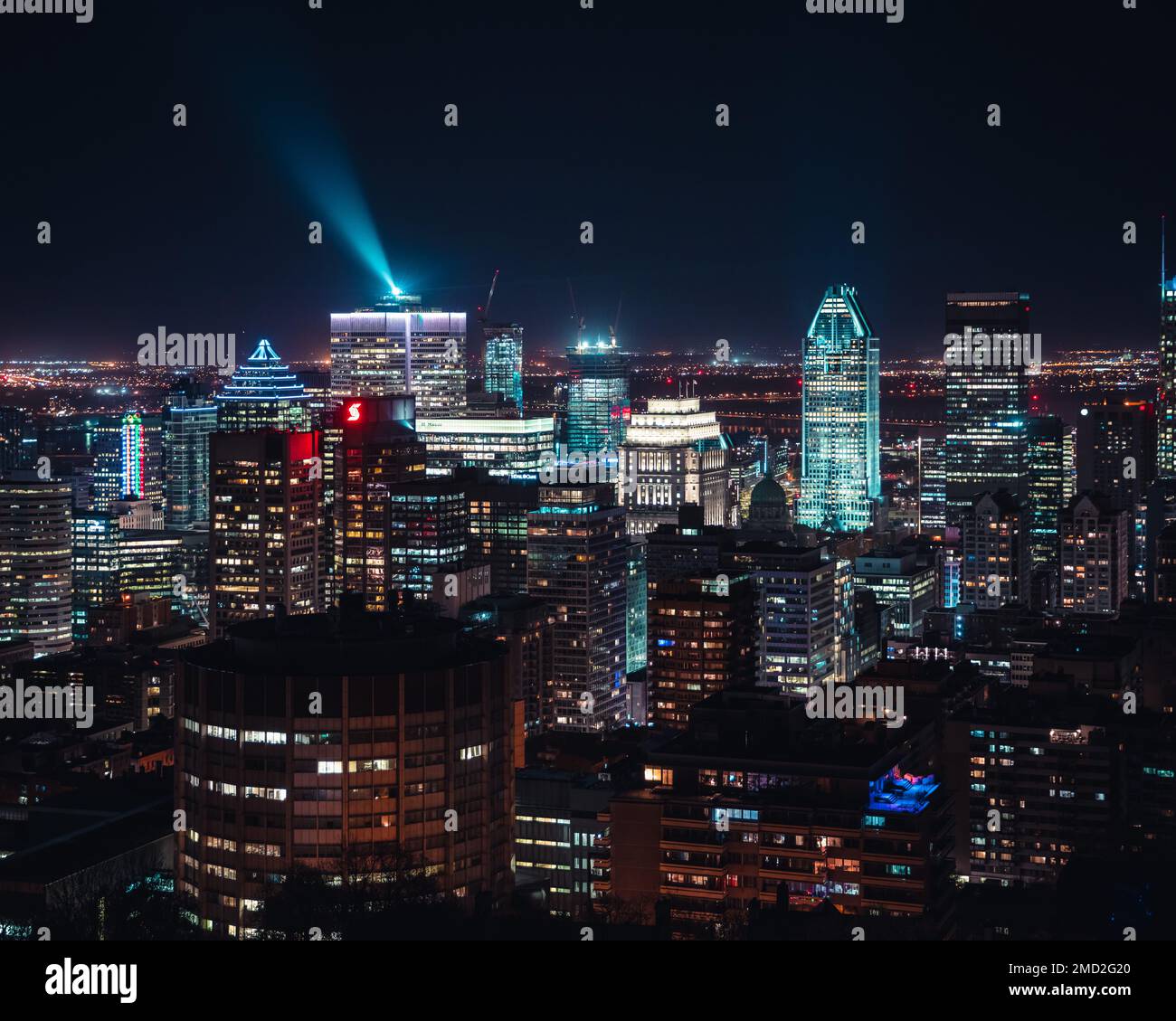 Downtown Montreal Skyscrapers at Night with bright Lights and Spotlight ...