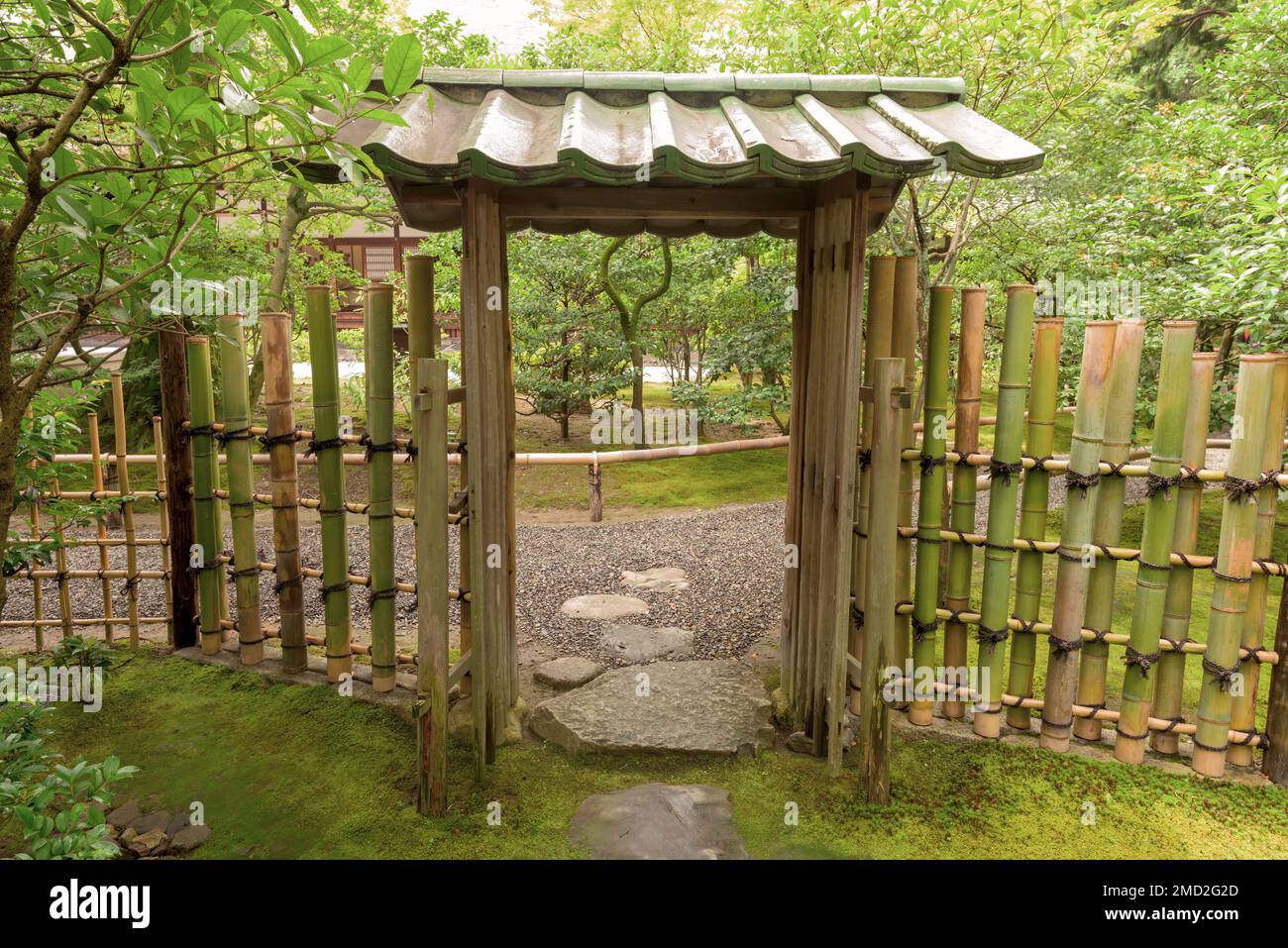 Beautiful garden fence gate leads to path Stock Photo - Alamy