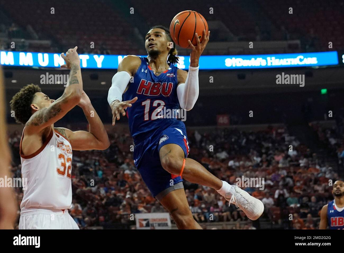 Houston Baptist forward Deshon Proctor (12) drives to the basket ...