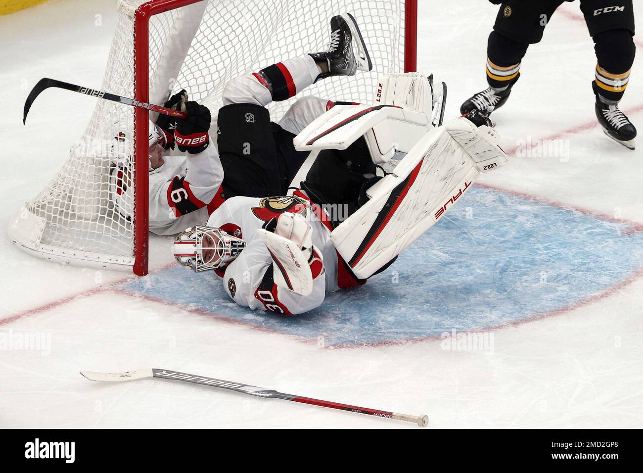 Ottawa Senators' Josh Norris collides with goaltender Matt Murray ...