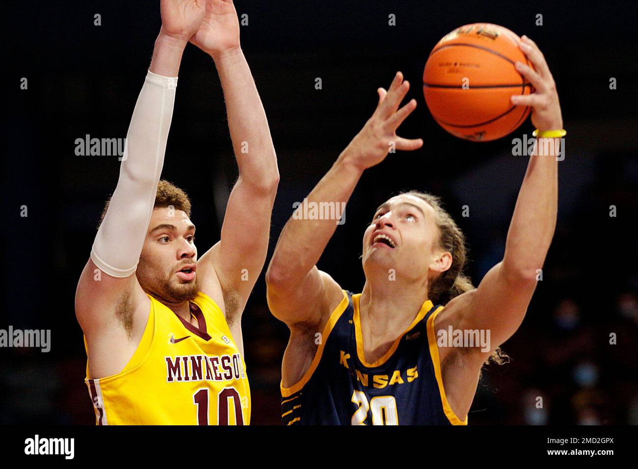 Kansas City forward Josiah Allick (20) shoots past Minnesota forward ...