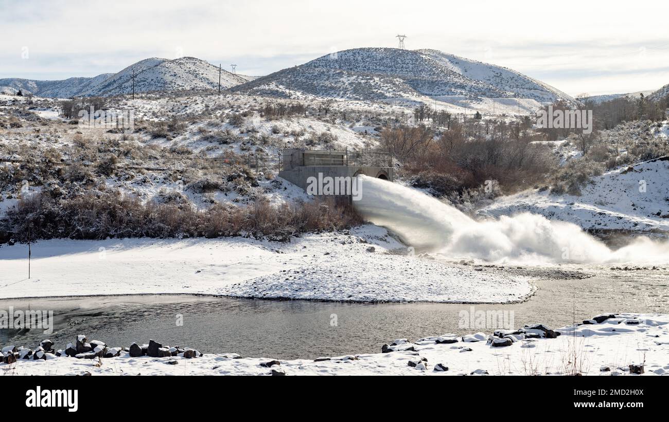 Hydroelectric Dam water faucet releasing water in winter Stock Photo ...