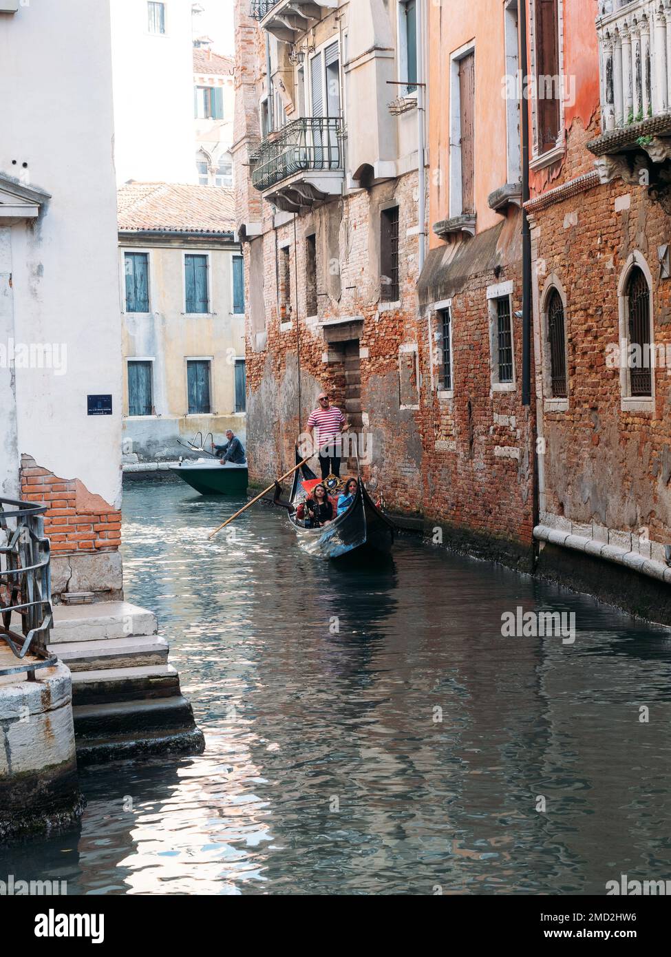 October 31, 2022 - Venice, Italy: People enjoying gondola ride through ...