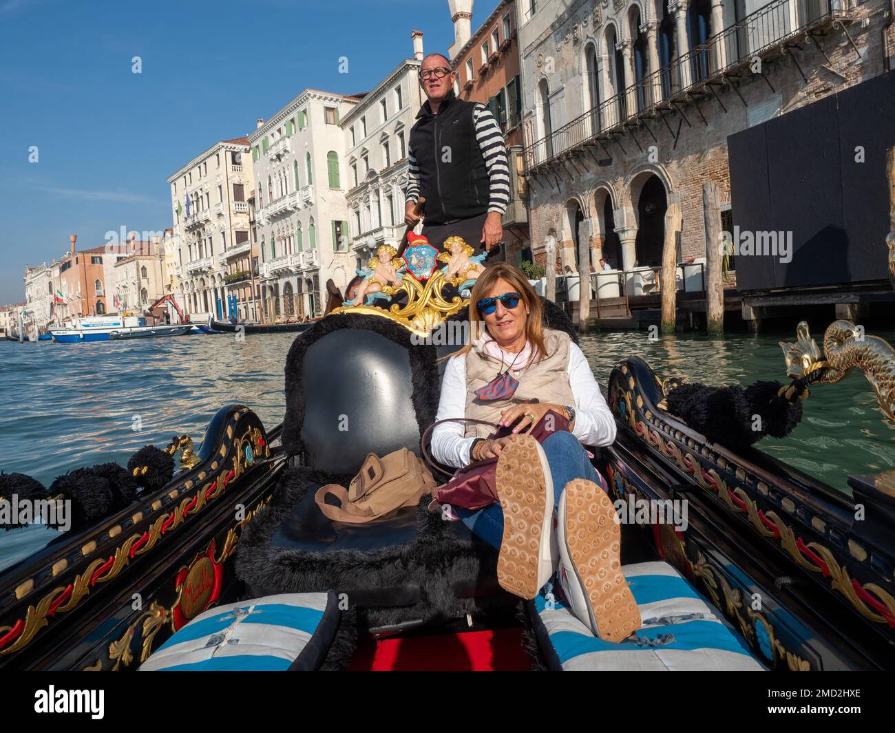 October 31, 2022 - Venice, Italy: Woman enjoying a gondola ride in ...